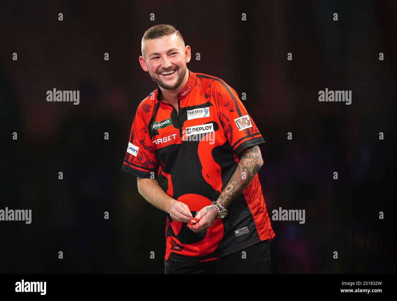 Nathan Aspinall reacts in the quarter-final match against Luke Littler ...