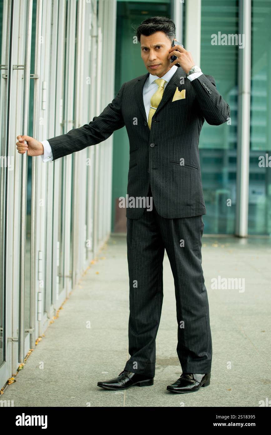Serious smartly dressed man talking hi-res stock photography and images ...
