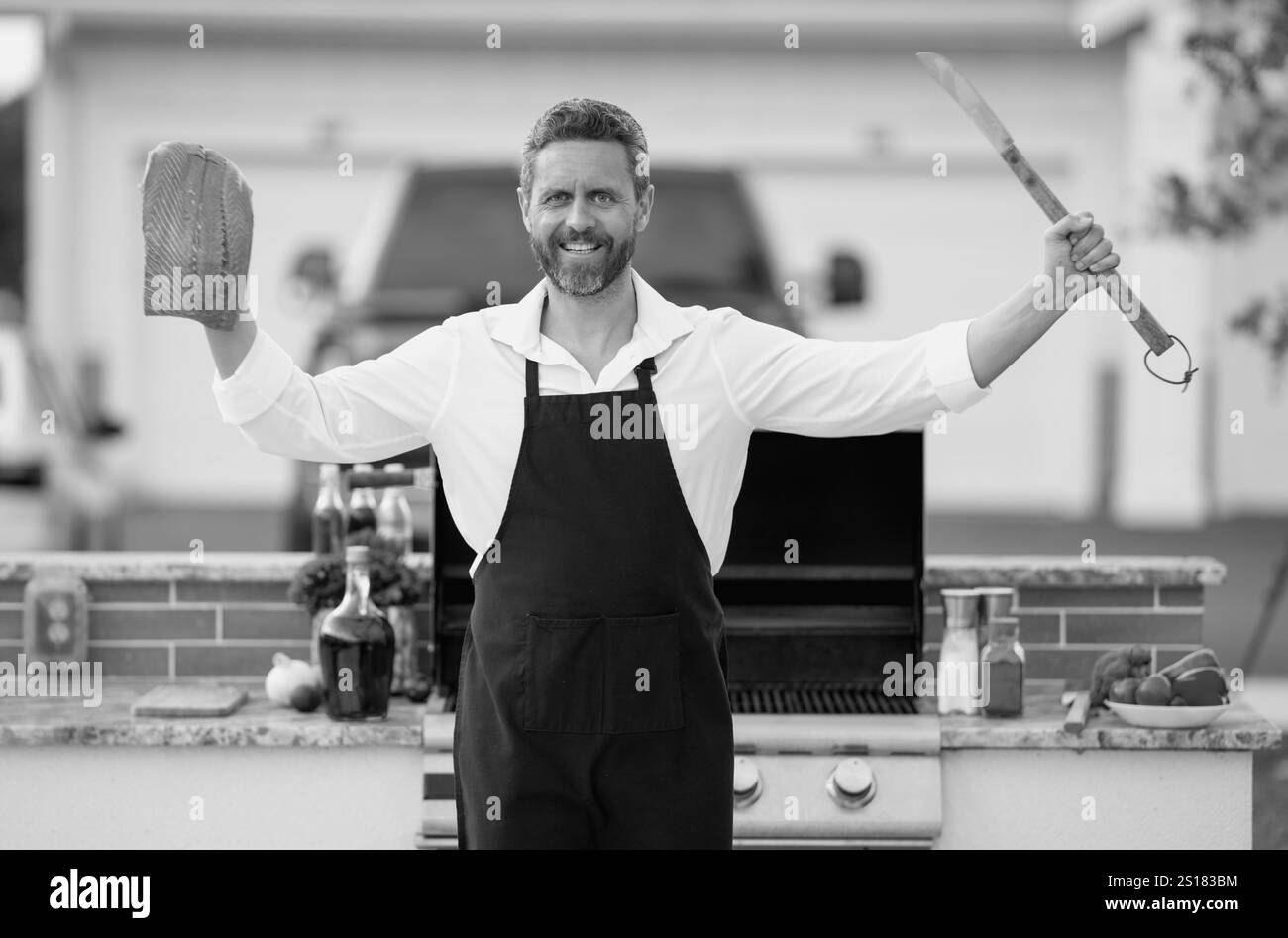 Chef grilling fresh seafood Black and White Stock Photos & Images - Alamy