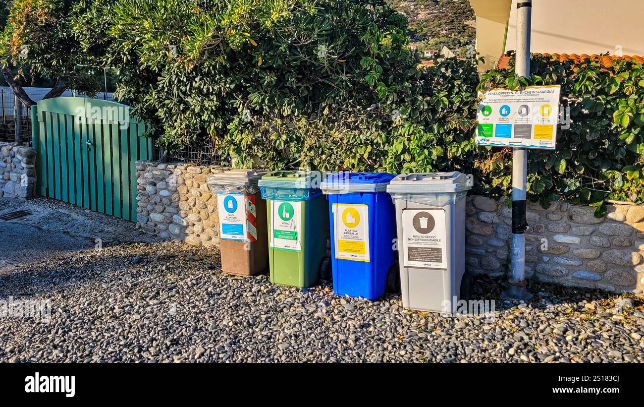 Four multicolored garbage sorting containers in the beach ...