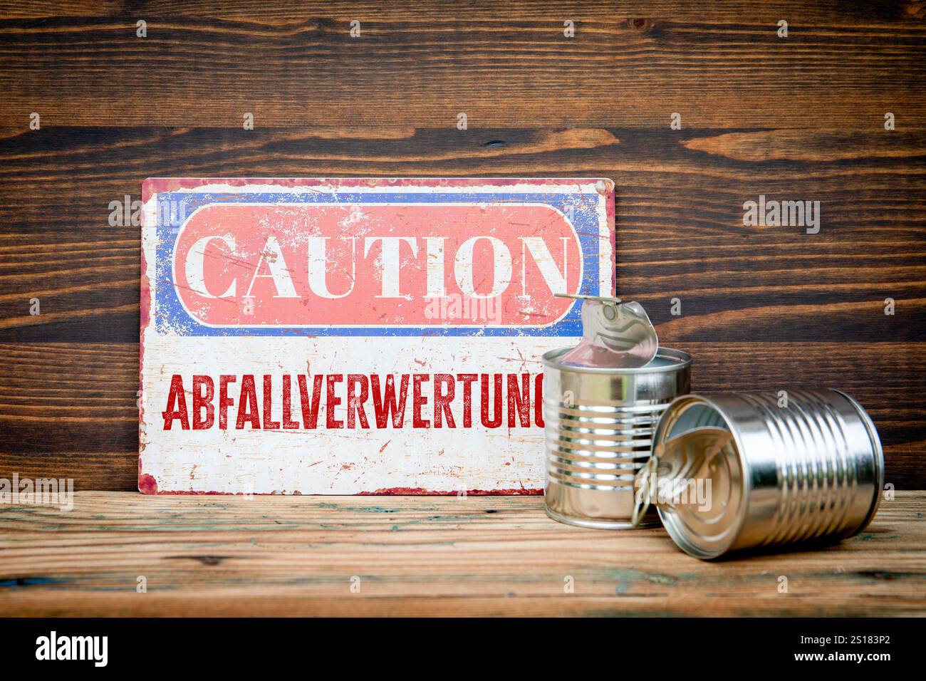 Waste recycling text in German. Caution sign on a wooden texture ...