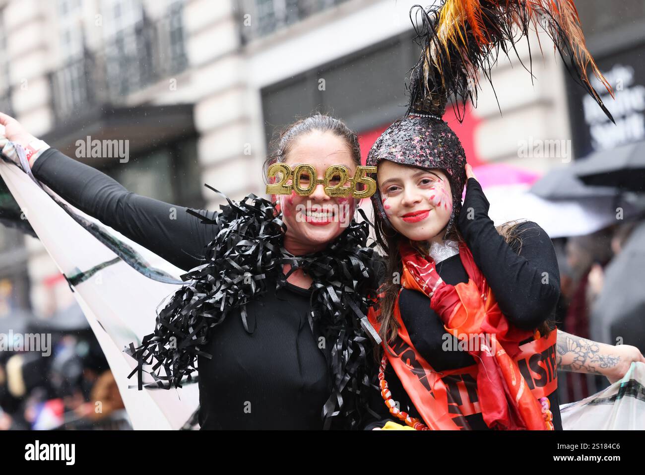 London, UK 1st January 2025.Revellers braved heavy rain to watch London ...