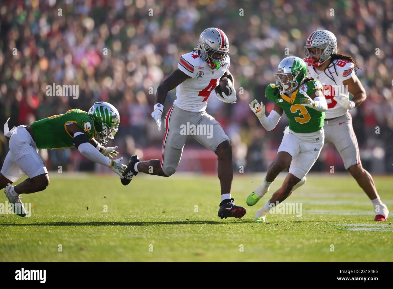 Ohio State wide receiver Jeremiah Smith (4) runs the ball during the first half in the ...