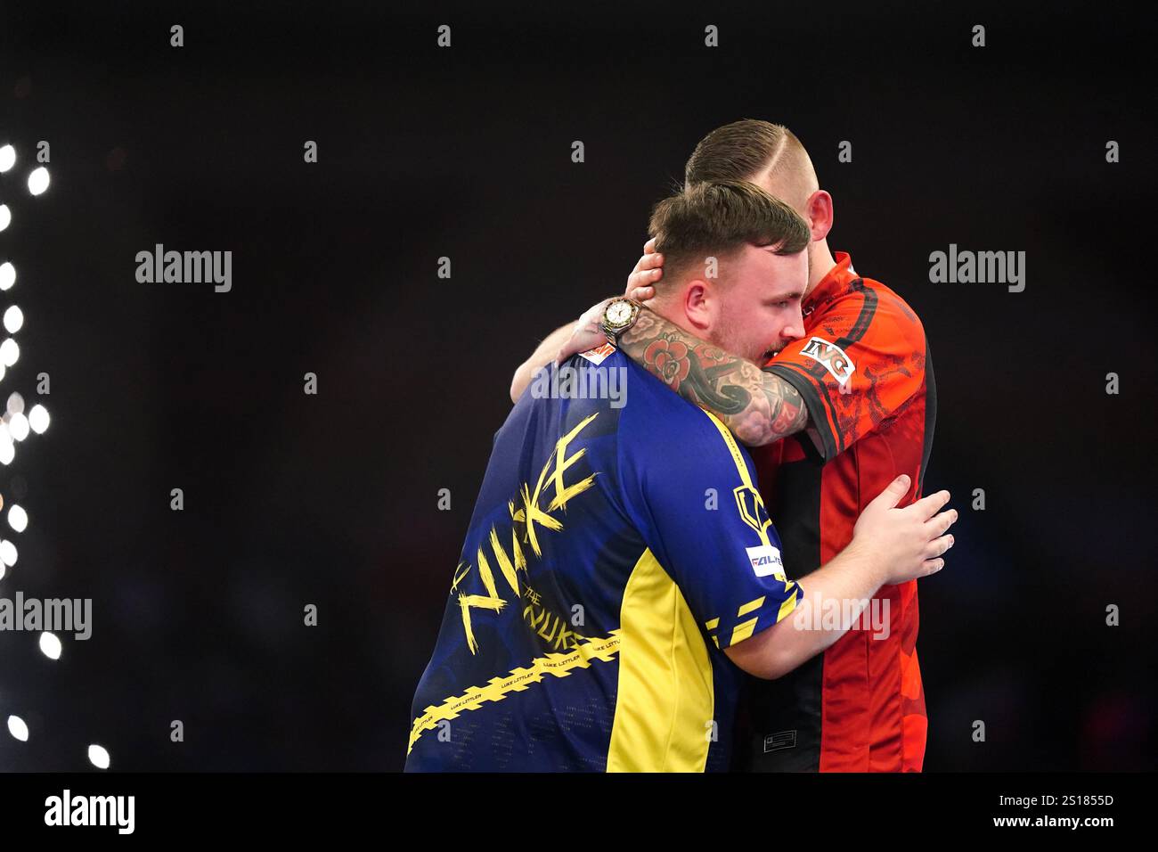 Luke Littler (left) celebrates victory following the quarter-final ...