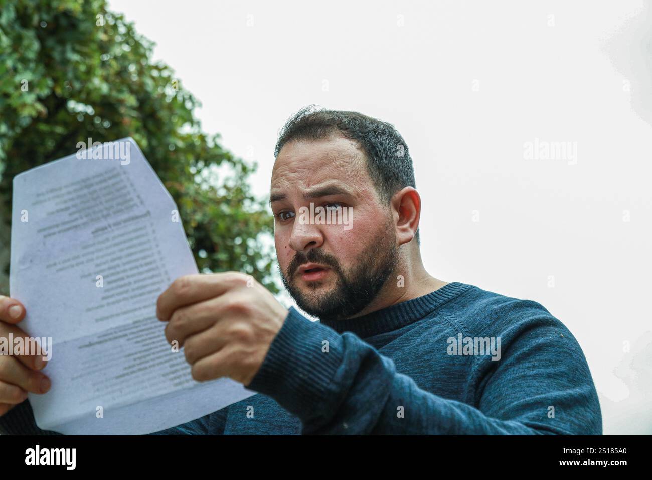 Expression Of Surprise While Reading Stock Photo - Alamy