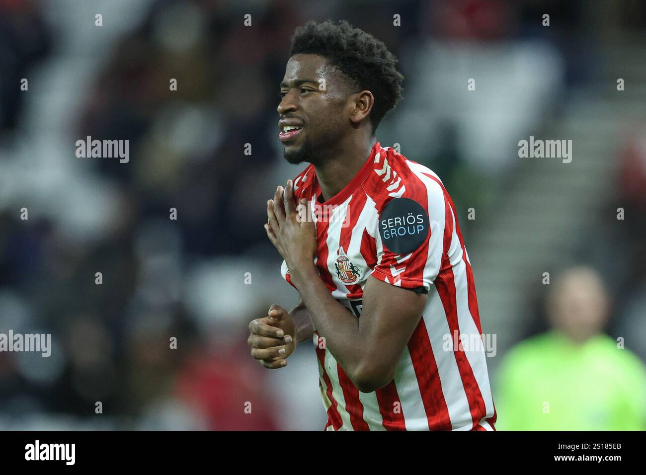 Sunderland, UK. 01st Jan, 2025. Aji Alese of Sunderland holds his shoulder after taking a knock ...