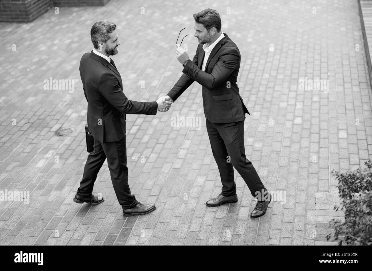 Business handshake outside in city Black and White Stock Photos ...