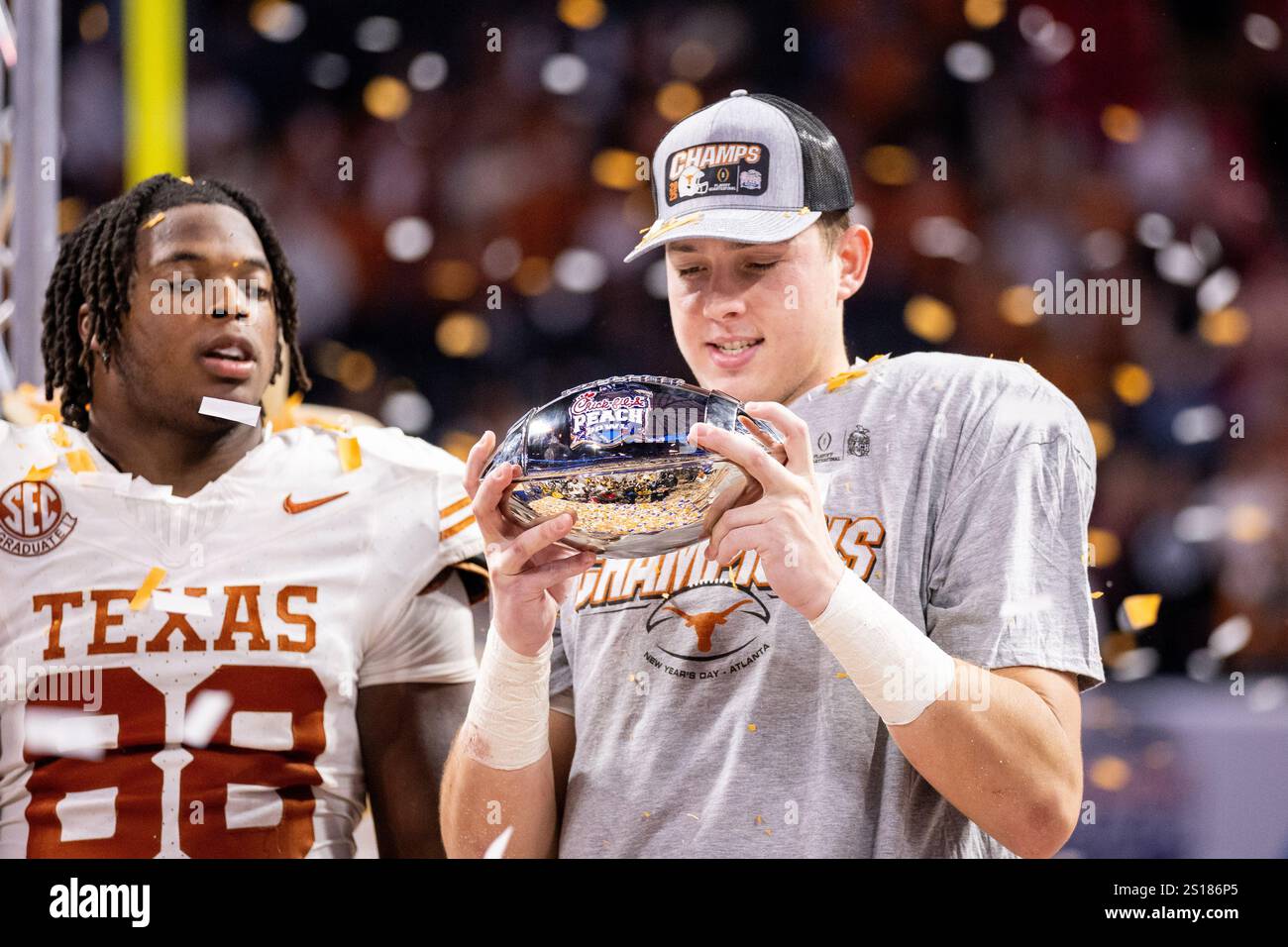 Atlanta, GA, USA. 1st Jan, 2025. Texas tight end Gunnar Helm (85) holds ...