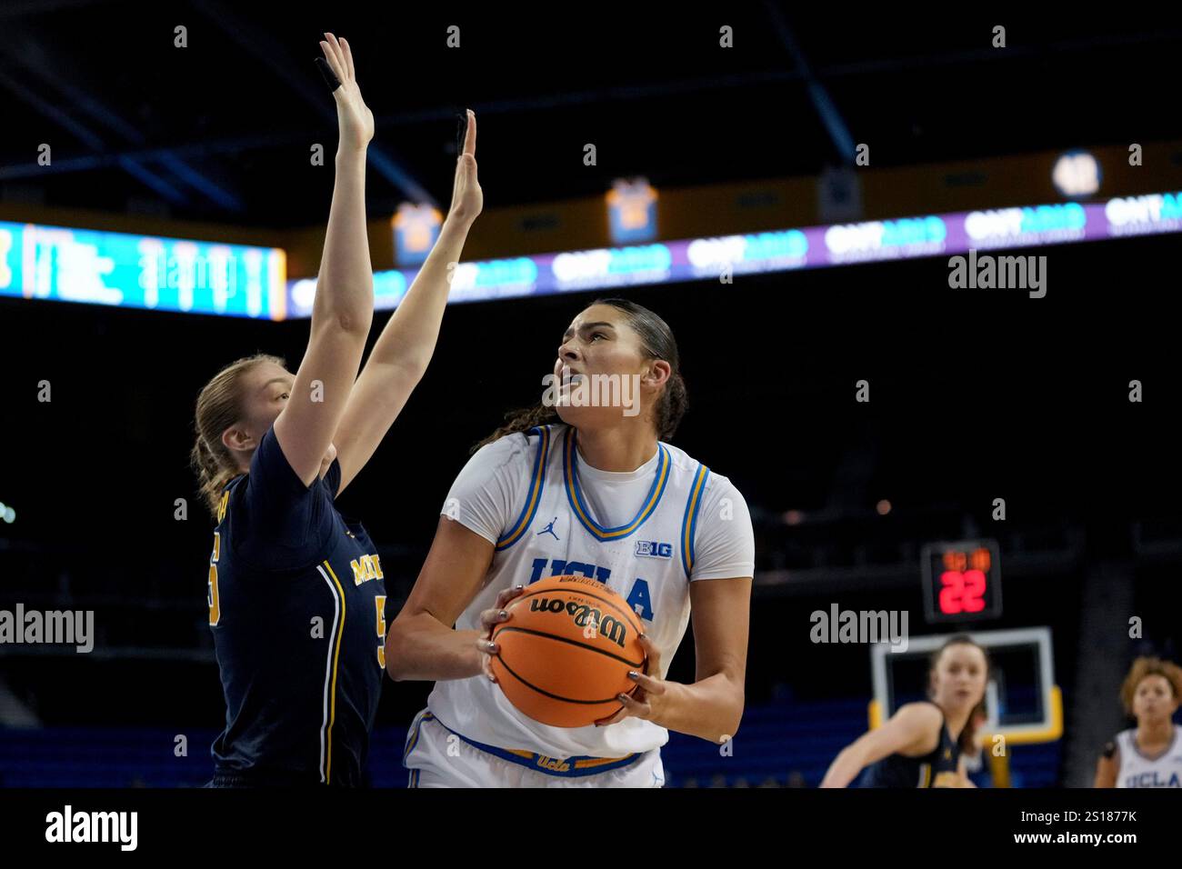 UCLA center Lauren Betts drives to the basket against Michigan guard ...