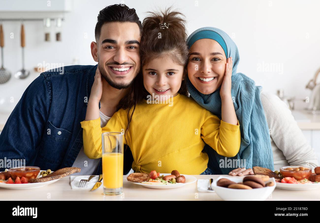 Portrait Of Happy Modern Islamic Family With Little Daughter Having ...