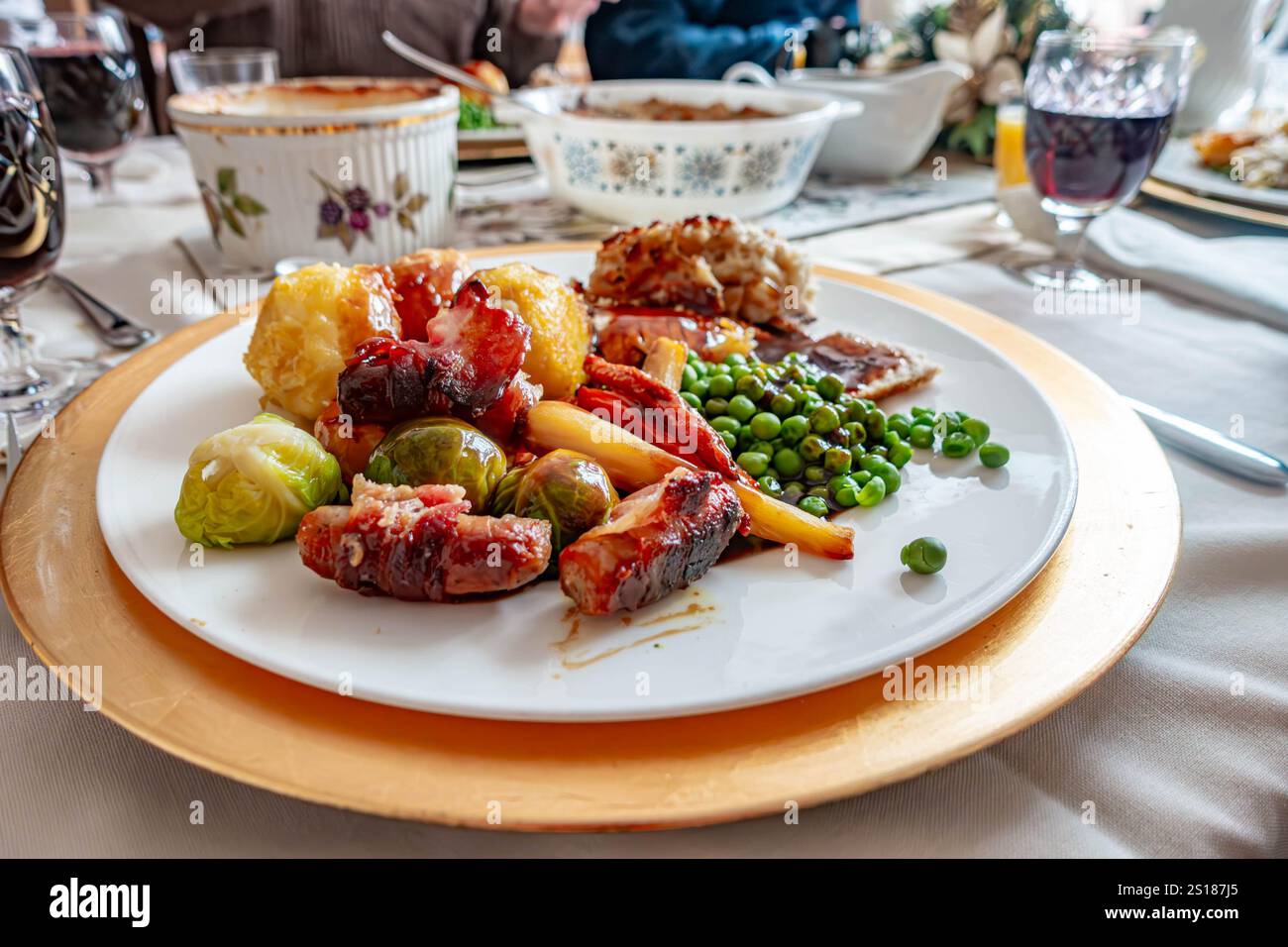 Close up view of a roast Christmas dinner with meat, vegetables and ...