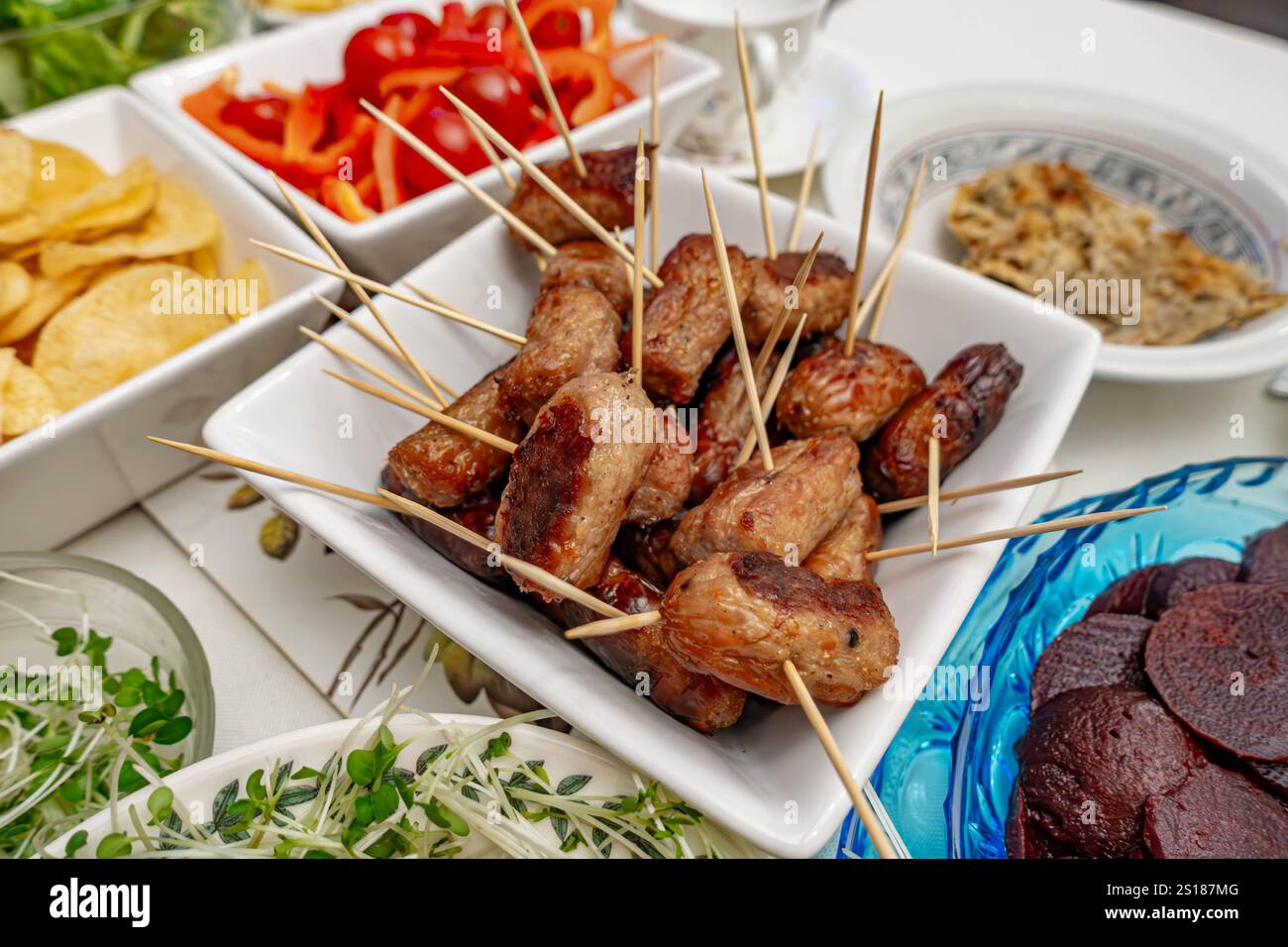 Cocktail sausages on sticks as part of a buffet lunch Stock Photo - Alamy