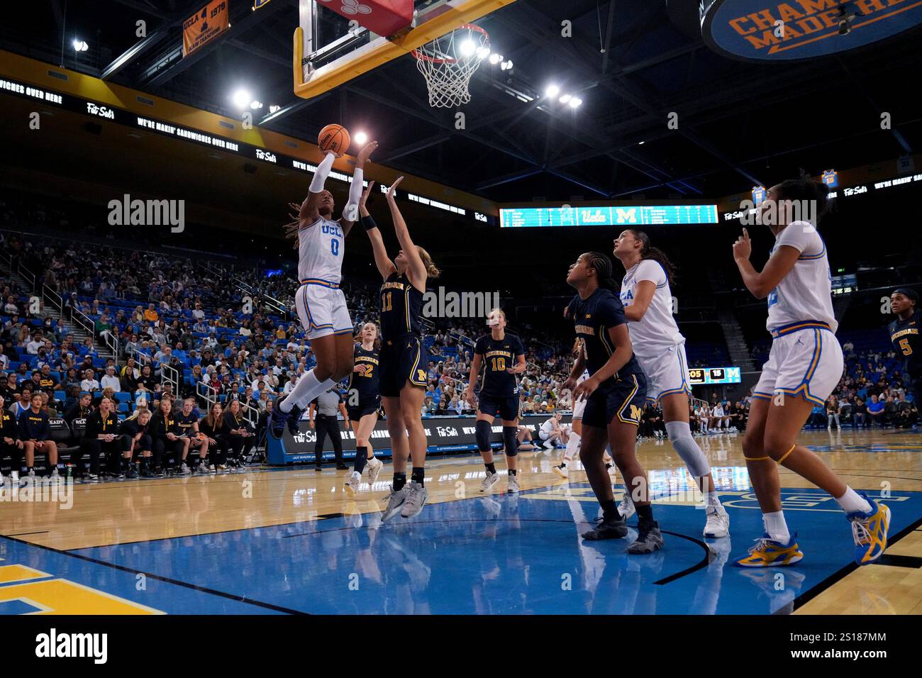 UCLA forward Janiah Barker (0) drives to the basket against Michigan ...