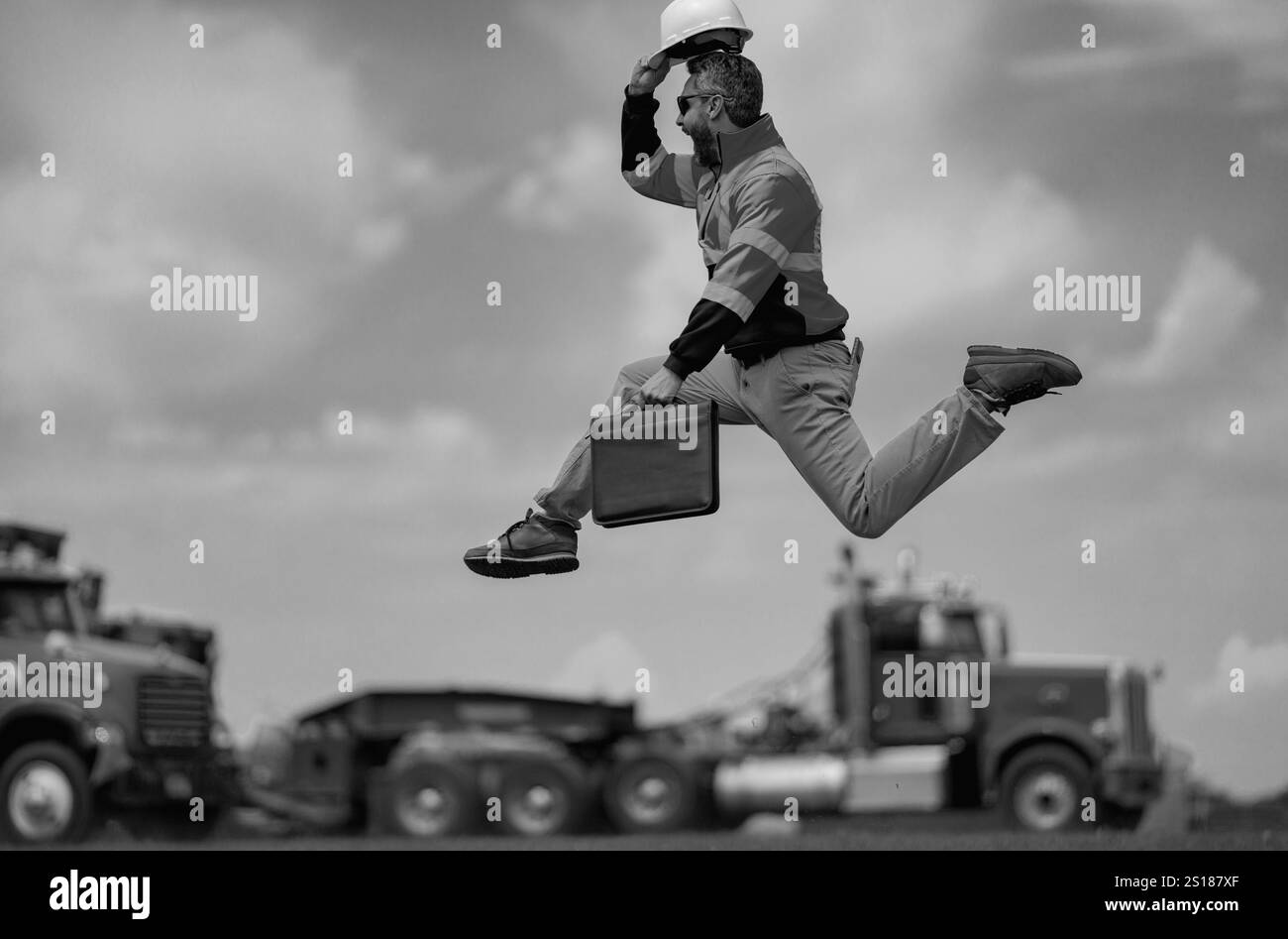 Caucasian man construction worker jump in helmet at building ...