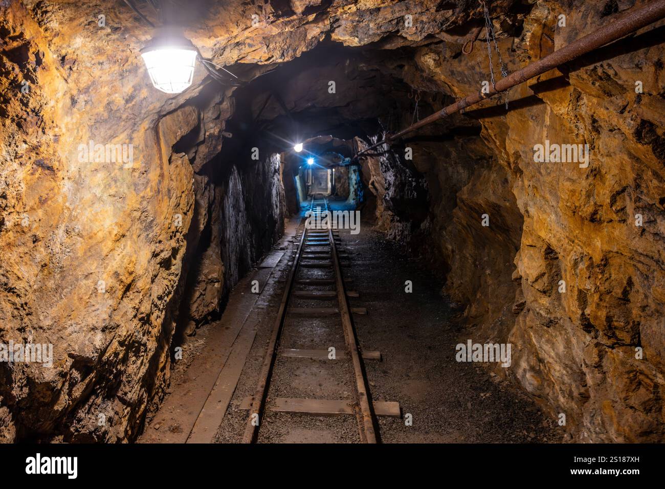 Deep within the Jachymov mine shaft in Czechia, a narrow tunnel reveals ...
