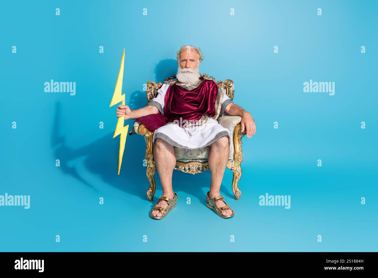 Full body photo of handsome senior male sit throne hold lightning wear ...