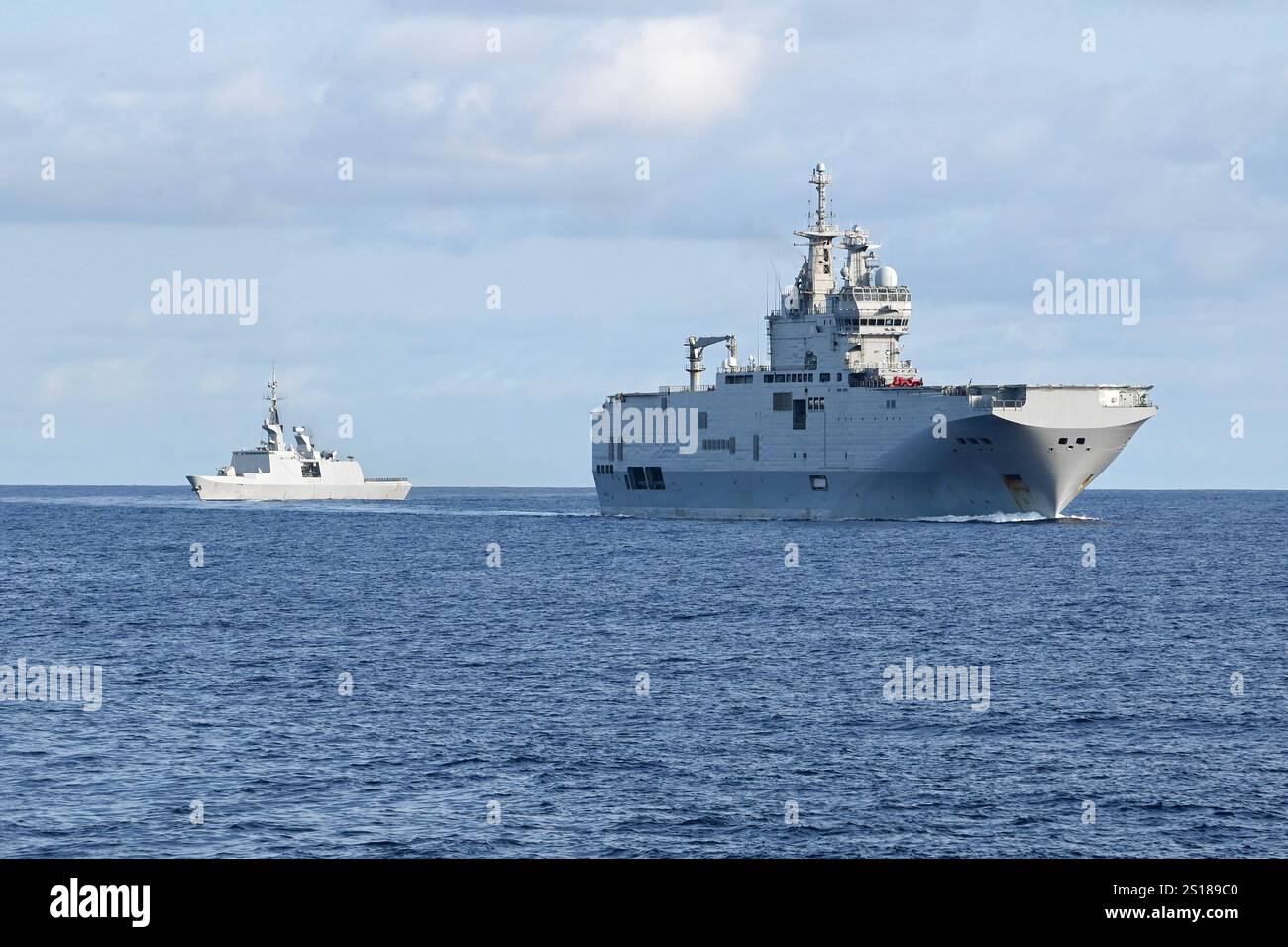 The crews of the French navy ships FS Tonnerre (L9014) and FS Guépratte ...