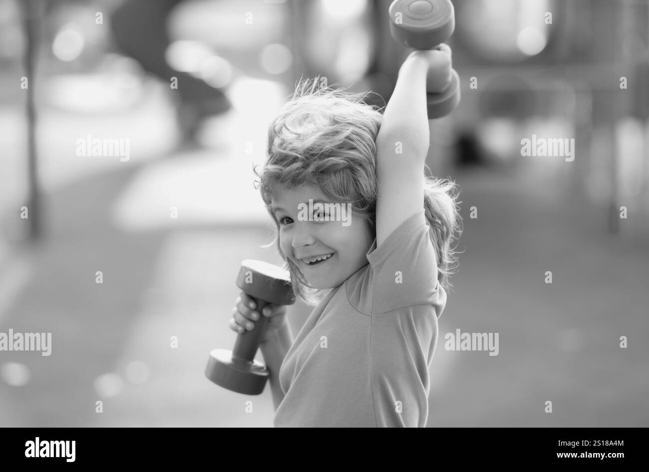 Kids sport training on playground outdoor. Child boy working out with ...