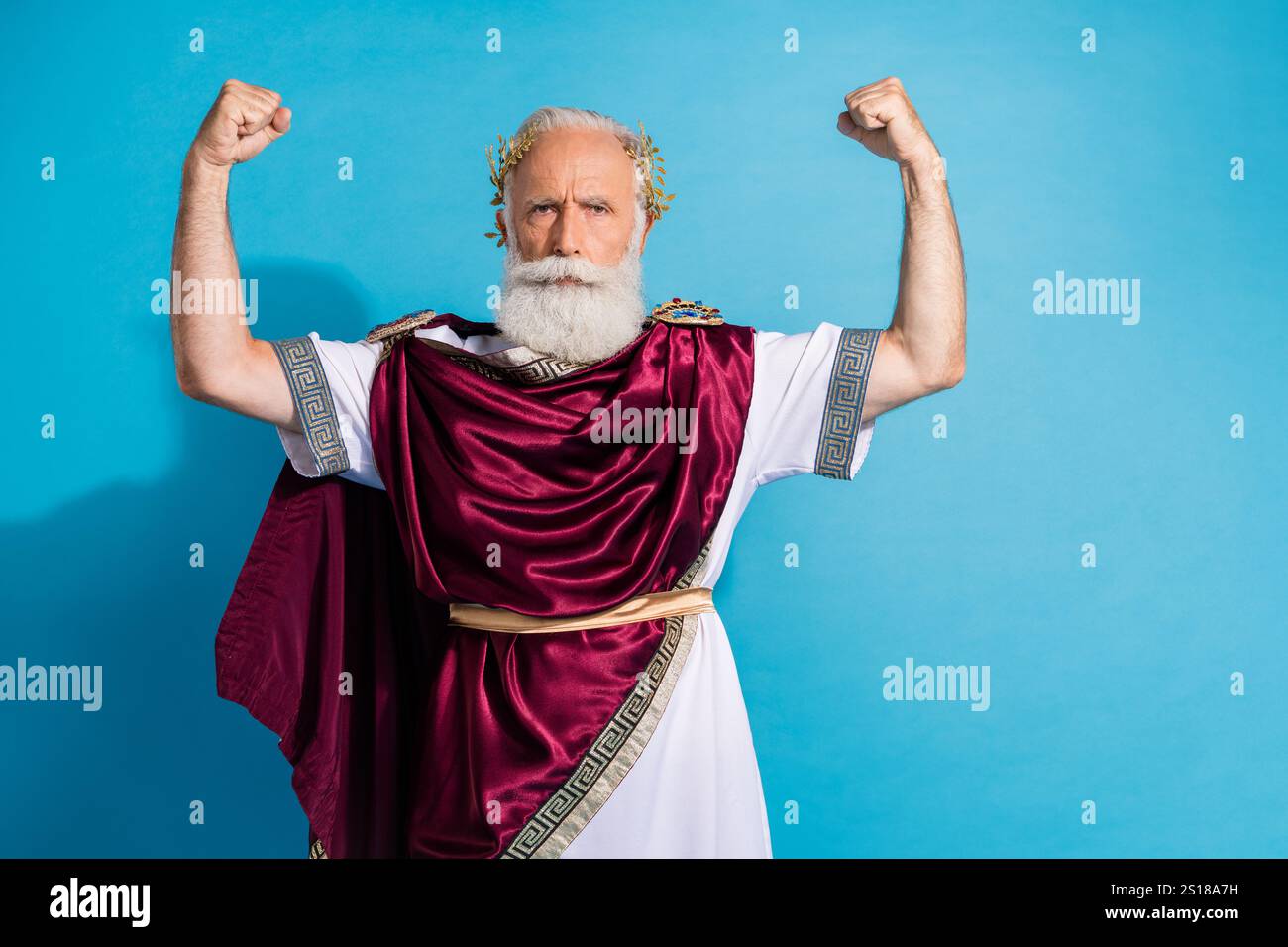 Photo of handsome senior male raise fists strong muscles wear ancient ...