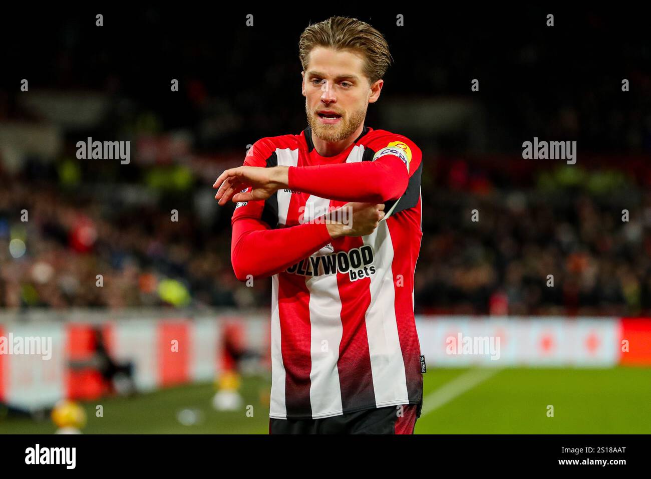 Mathias Jensen of Brentford puts on the captain’s armband during the ...