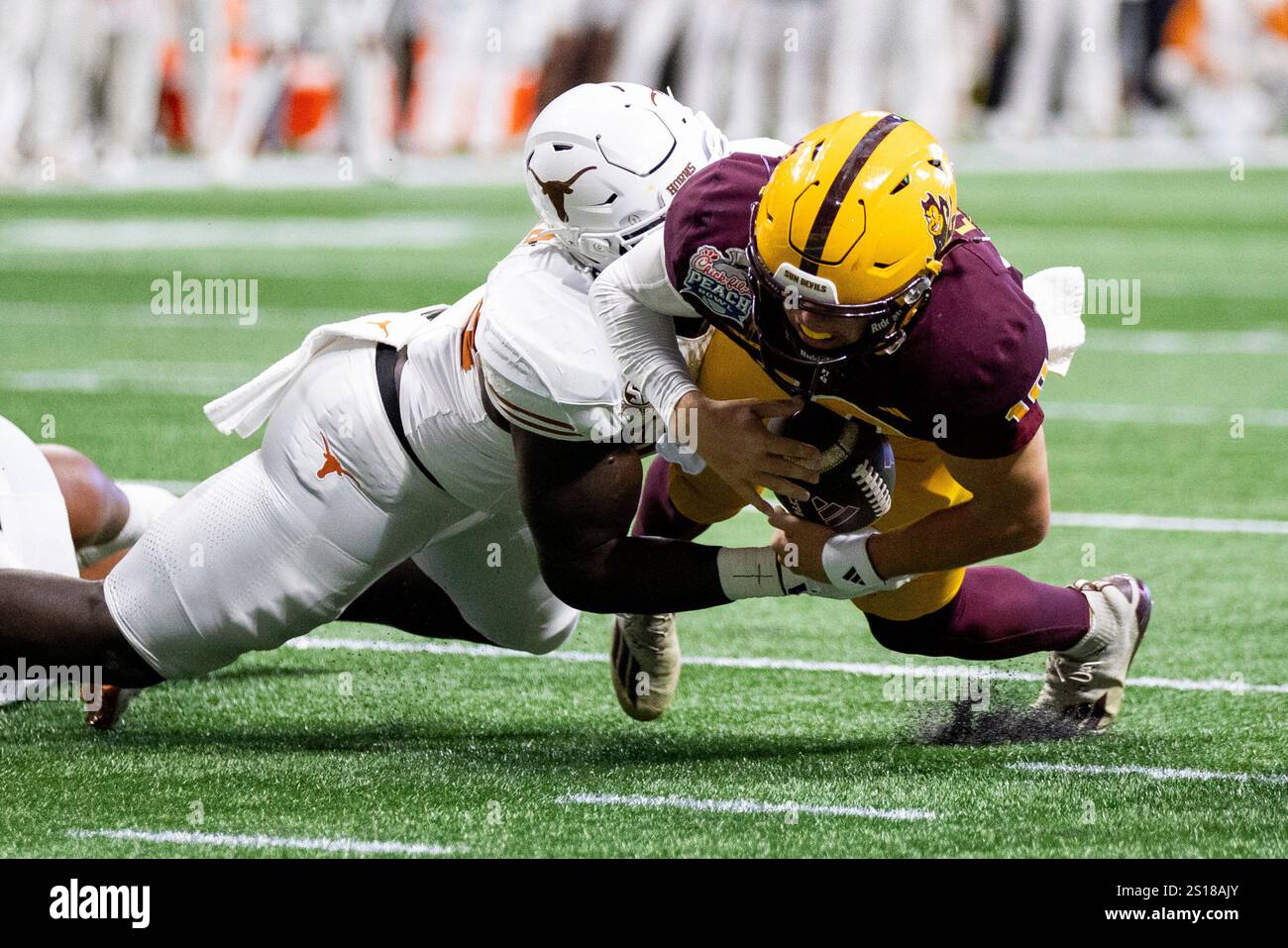 January 1, 2025: Texas linebacker David Gbenda (33) tackles Arizona ...