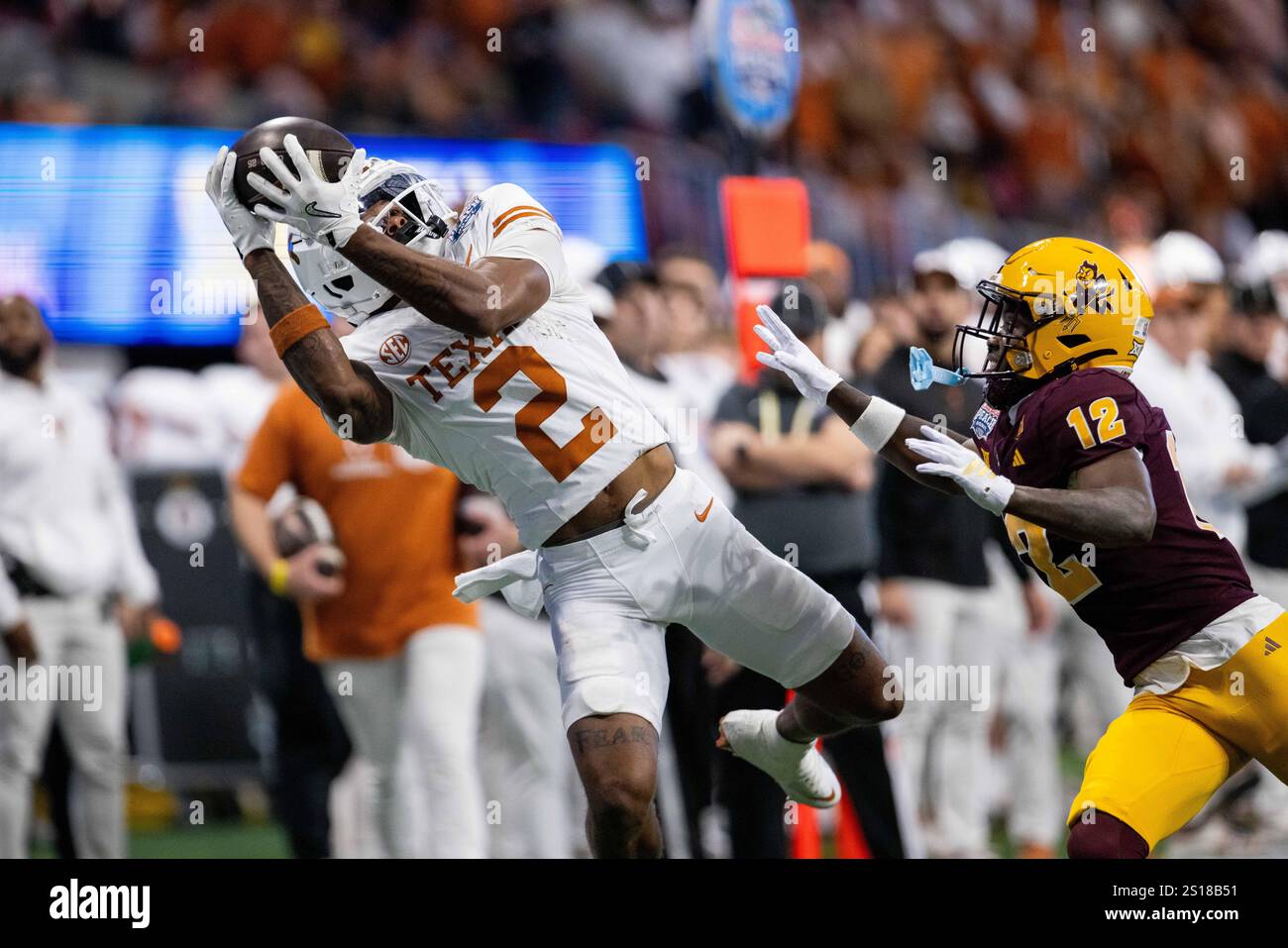 Atlanta, GA, USA. 1st Jan, 2025. Texas wide receiver Matthew Golden (2) makes a catch over ...