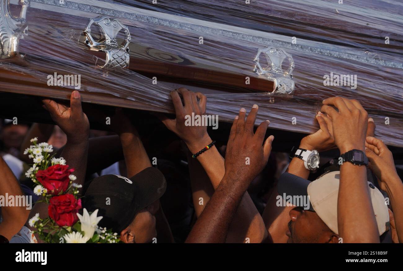 Family and friends carry the caskets of four children, who went missing ...