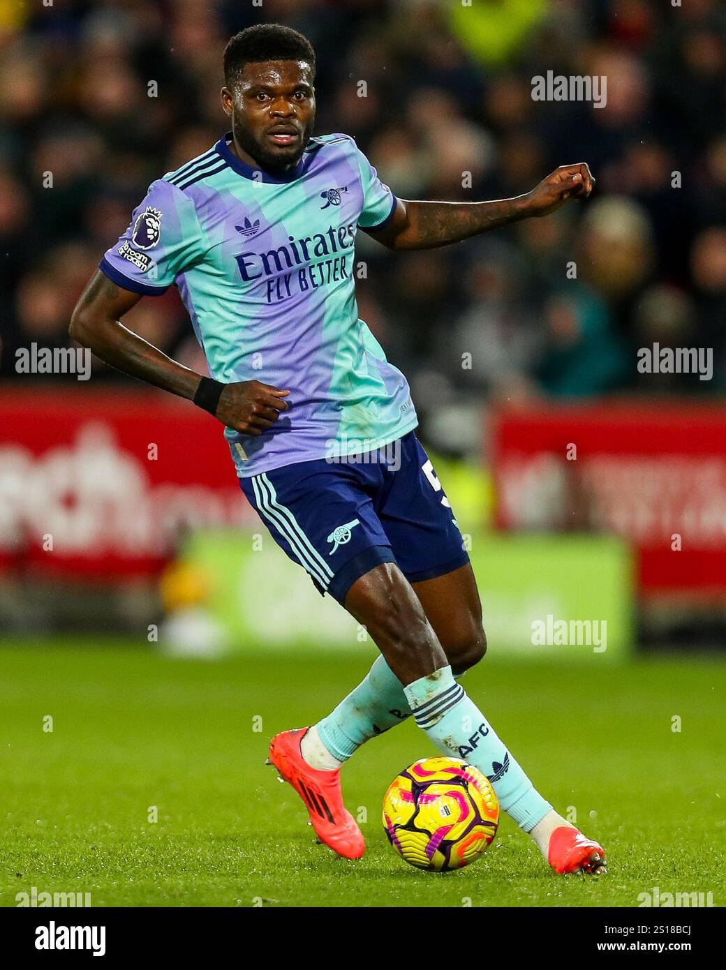 London, UK. 01st Jan, 2025. Thomas of Arsenal controls the ball during ...