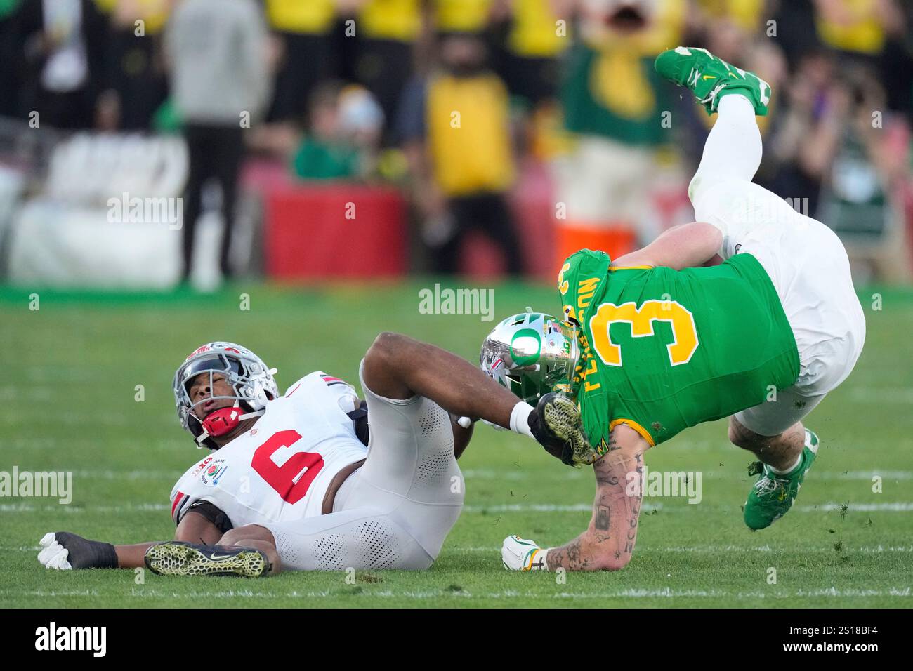 Oregon tight end Terrance Ferguson (3) is upended by Ohio State safety ...