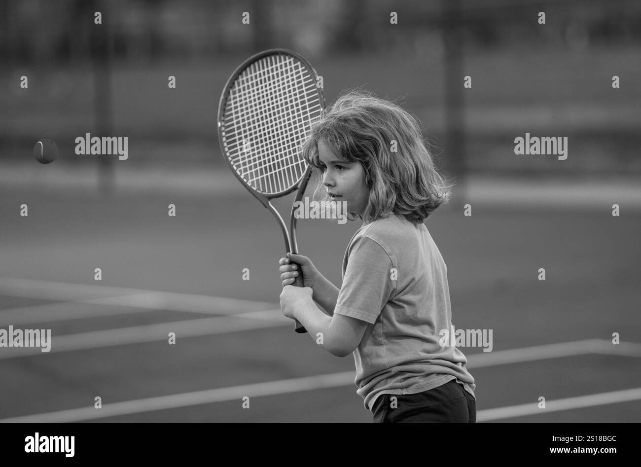 Kids playing tennis court Black and White Stock Photos & Images - Alamy