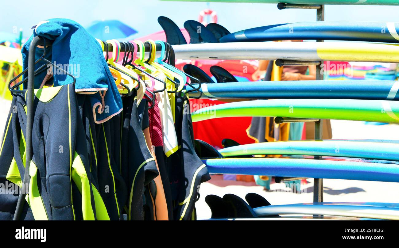 Surfboards and uniforms on the beach of Atlantic ocean at the surf ...