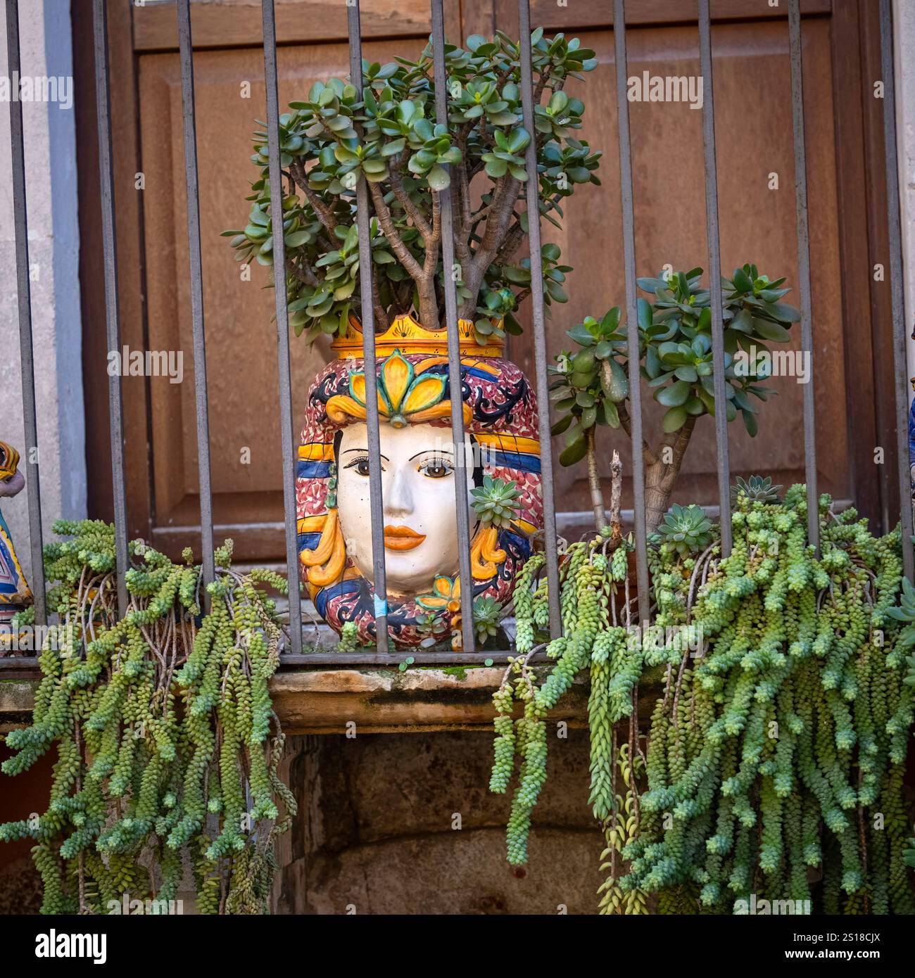 Sicilian Moorish head pot on balcony in Taormina, Sicily, Italy Stock ...