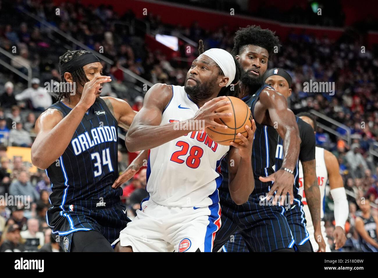 Detroit Pistons center Isaiah Stewart (28) is defended by Orlando Magic ...