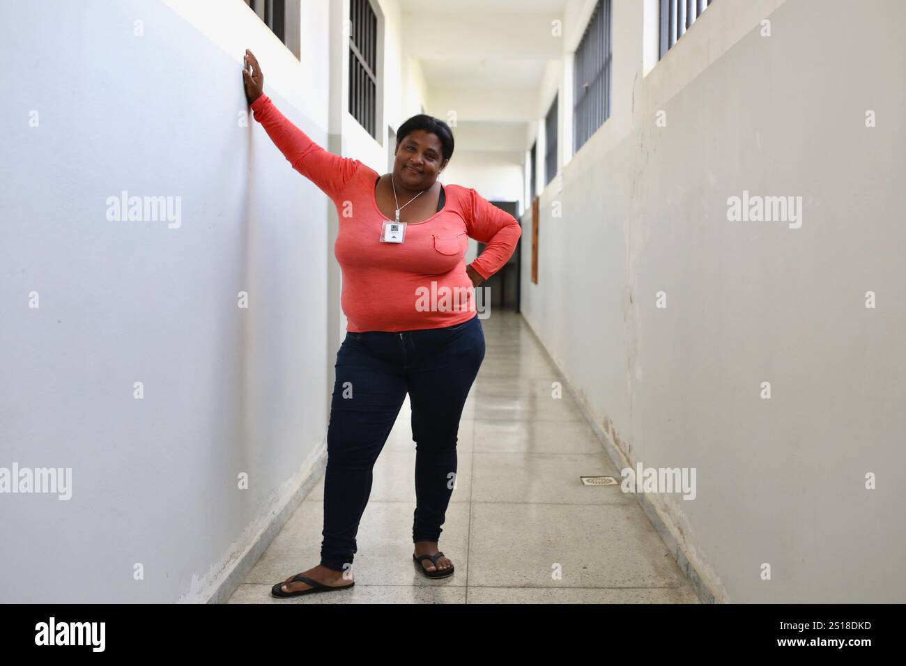 An inmate poses for a photo in the corridor serving the cells of the ...