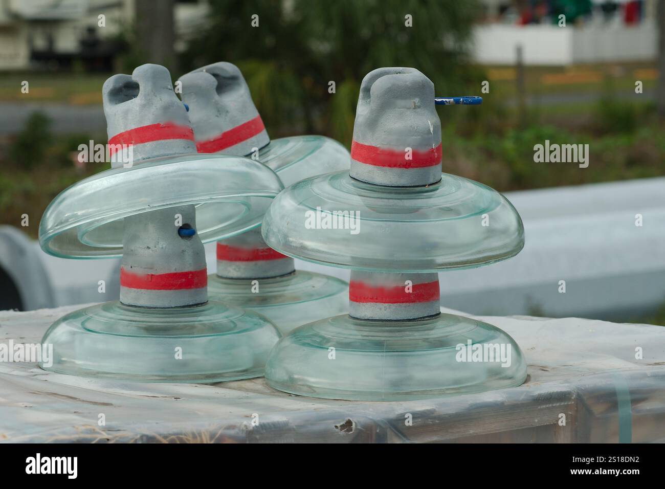 Close up view glass electric insulator on top of a box in an Electric ...