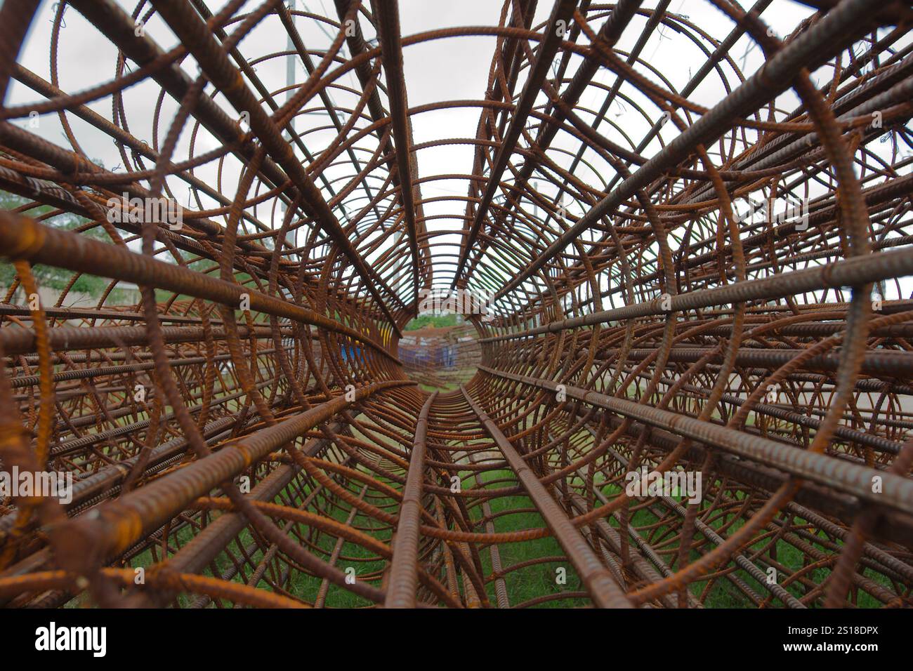 View down rusty round rebar tube reinforcement leading lines to ...