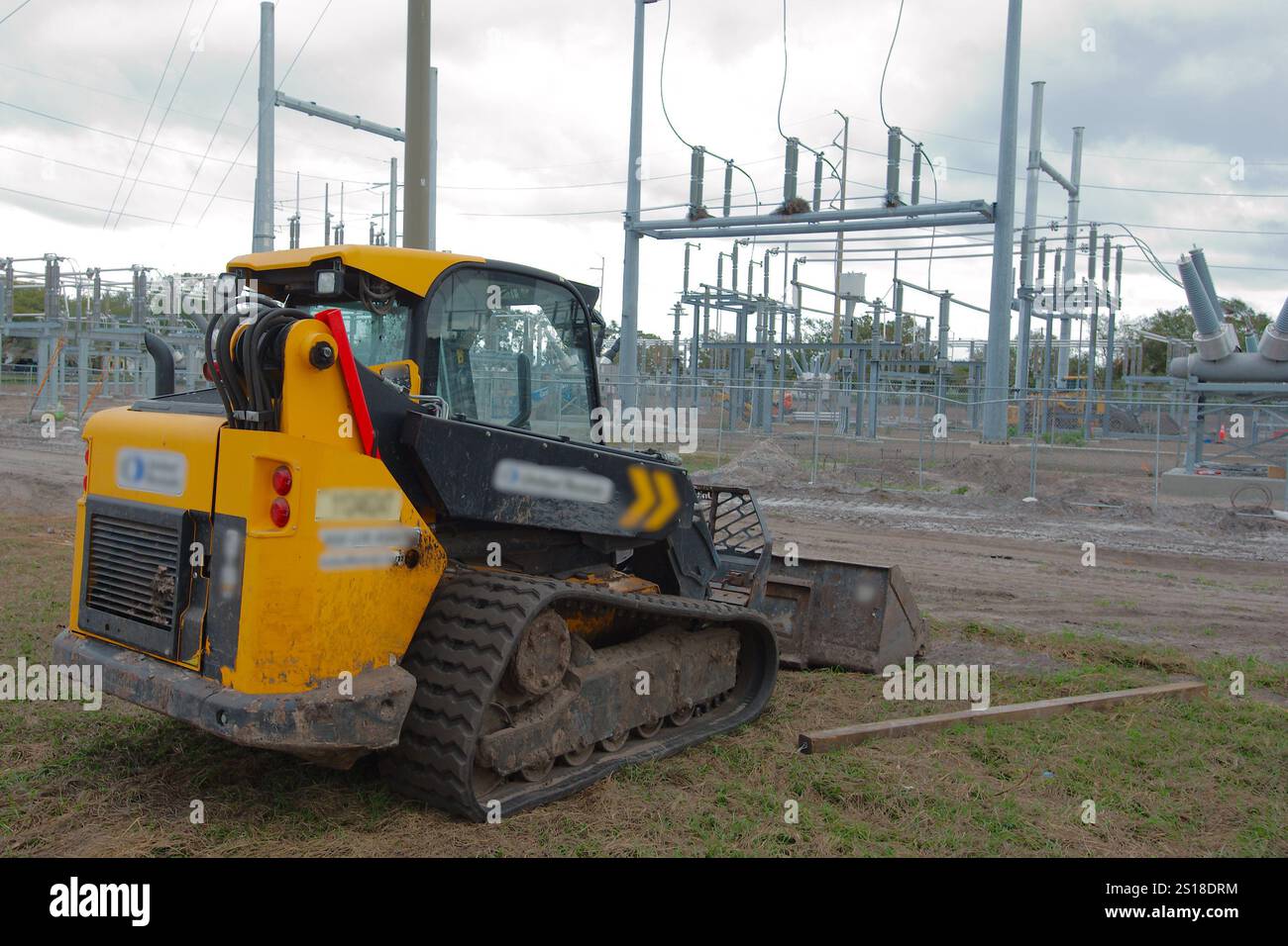 Wide view of an urban Electric substation. Construction vehicles With ...