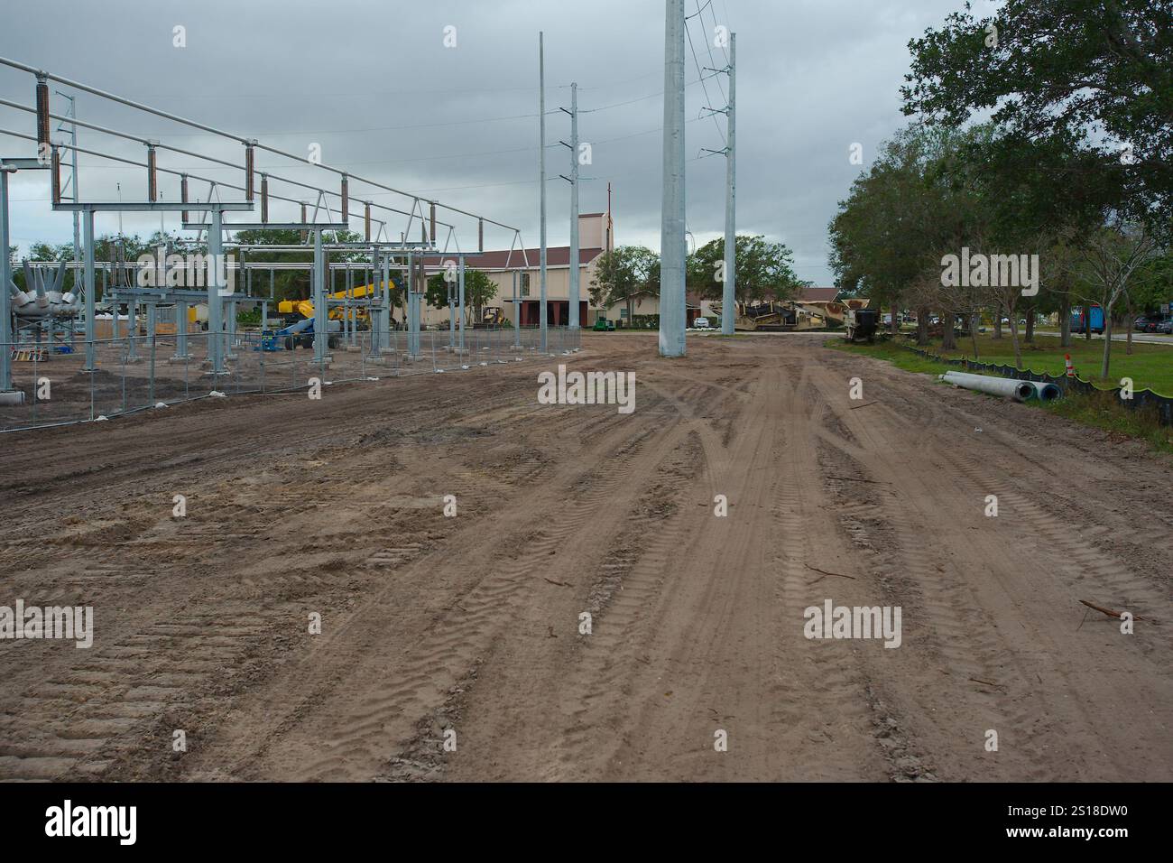 Wide view of an urban Electric substation. Construction vehicles With ...