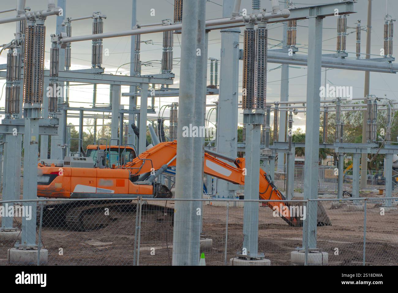 Wide view of an urban Electric substation. Construction vehicles With ...
