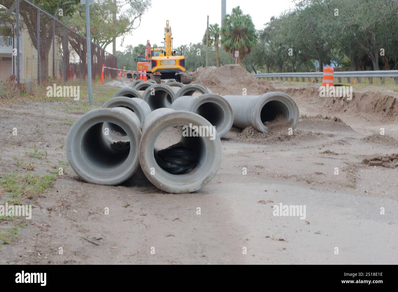 Wide view over large concrete culvert pipe. At a large construction ...