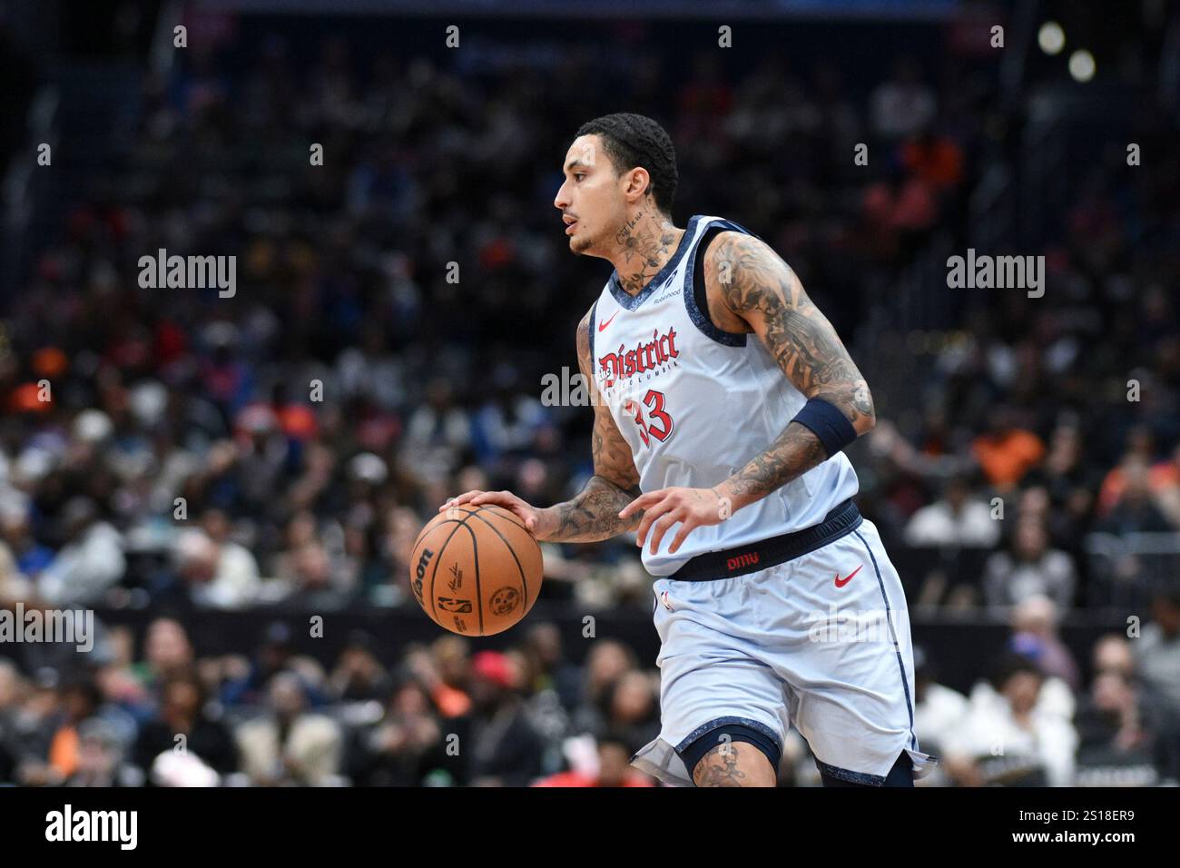 Washington Wizards forward Kyle Kuzma (33) brings the ball up court ...