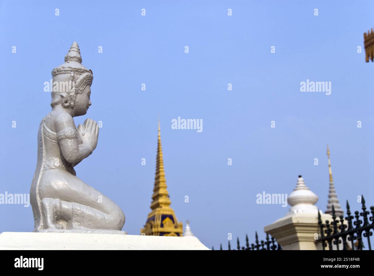 A colorful painted praying figure decorates the walls of the Royal ...