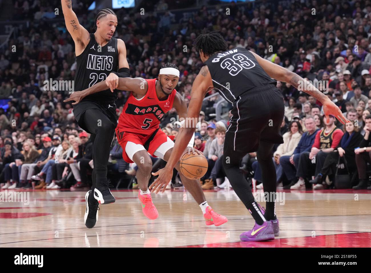 Toronto, Can. 01st Jan, 2025. Toronto Raptors' Immanuel Quickley (5 ...