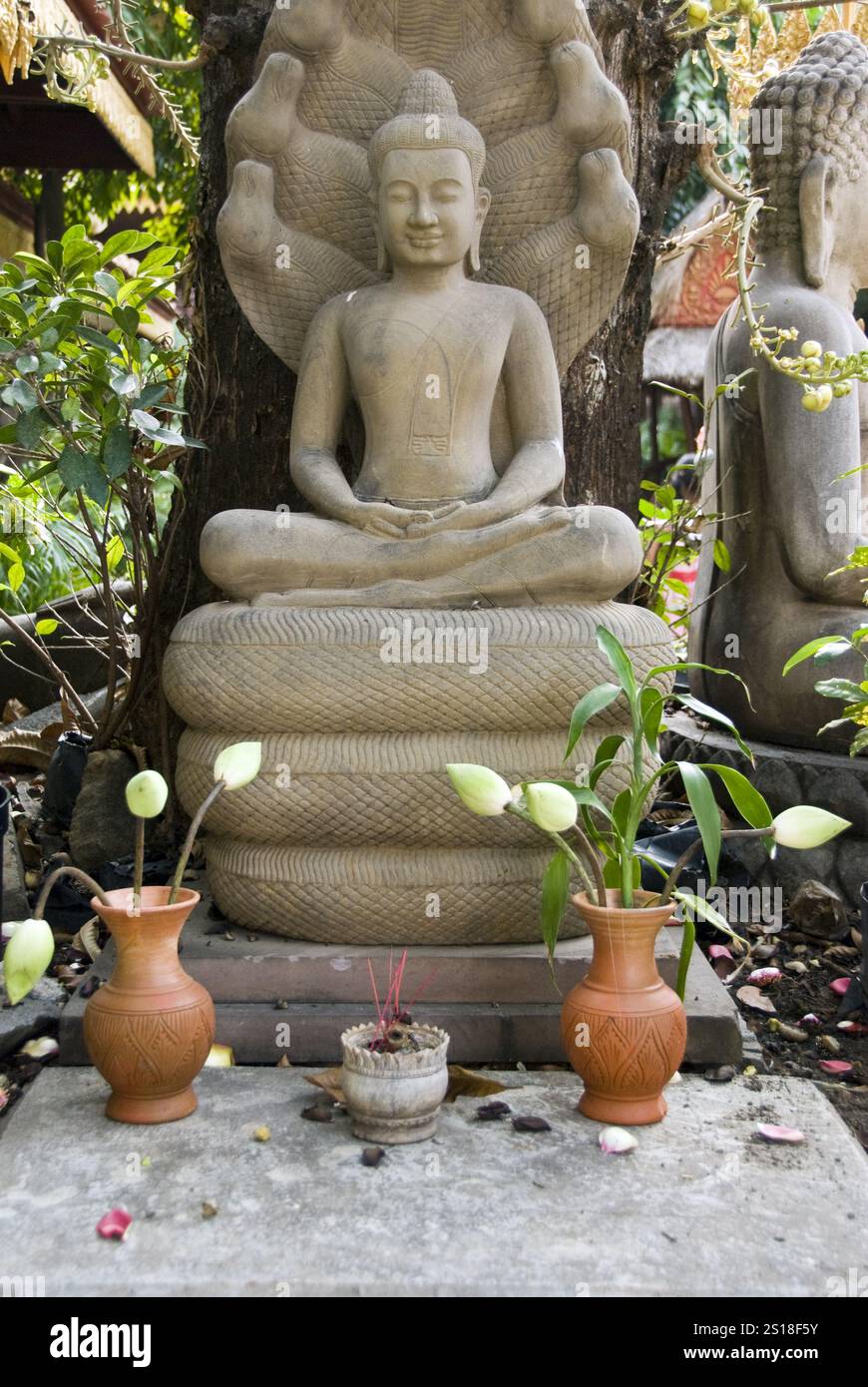A Buddha statue at an altar in the Royal Palace complex, the royal ...