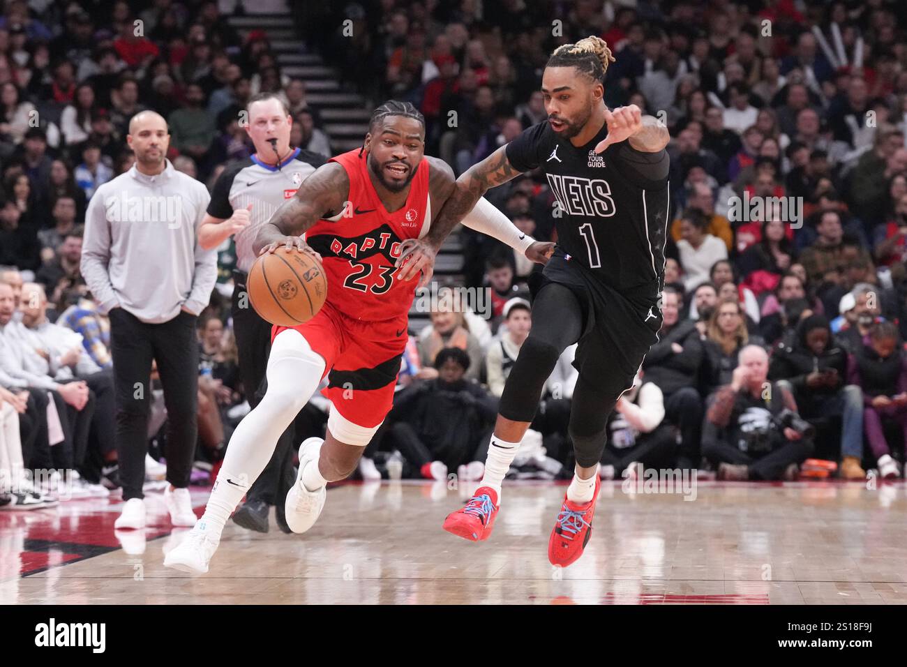 Toronto, Can. 01st Jan, 2025. Toronto Raptors' Jamal Shead (23) drives ...