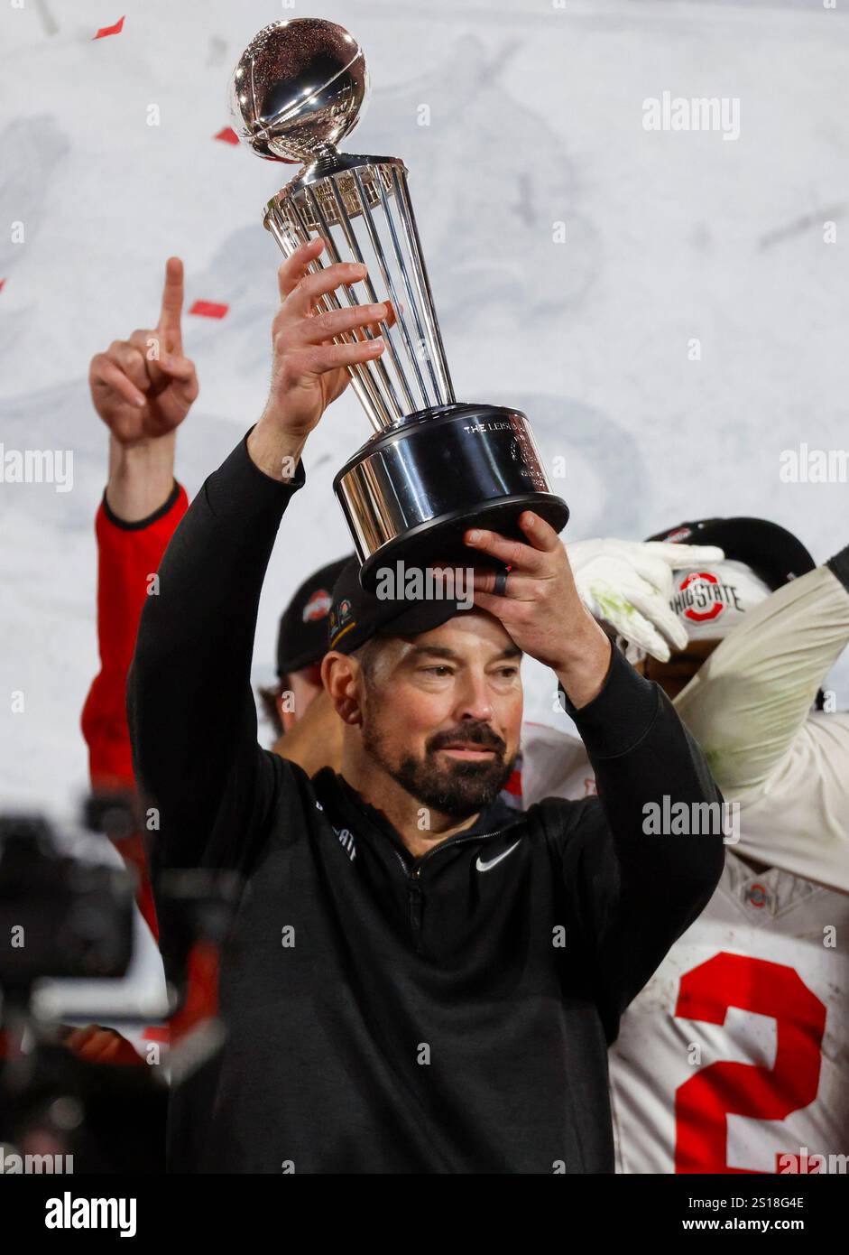 January 01, 2025 Ohio State Buckeyes head coach Ryan Day holds up the ...
