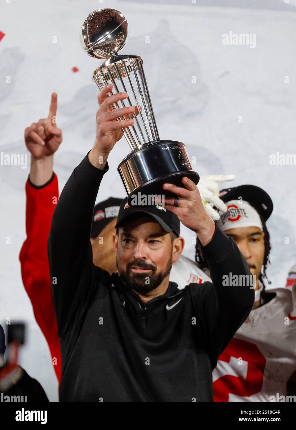 January 01, 2025 Ohio State Buckeyes head coach Ryan Day holds up the ...