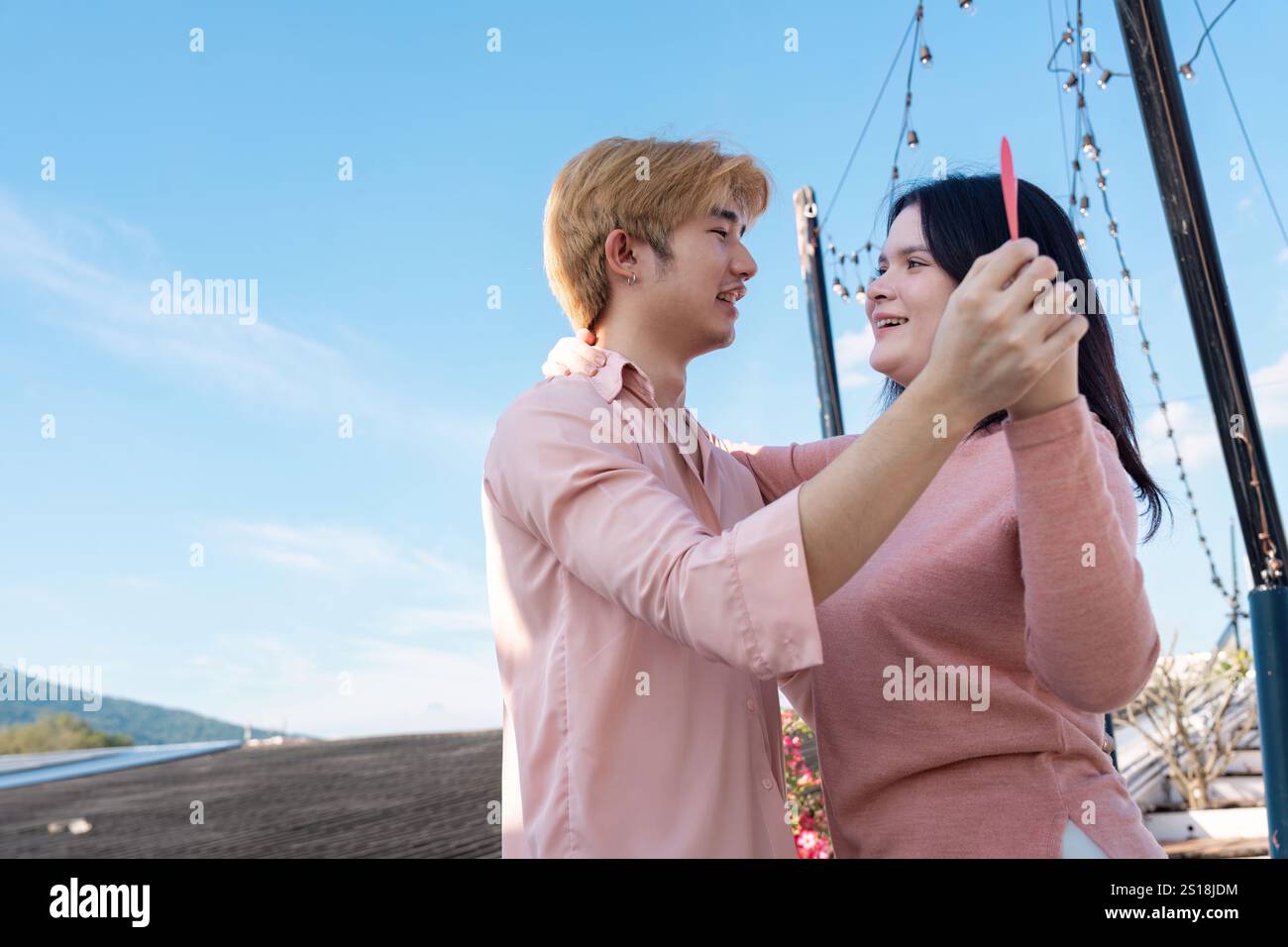 Valentine celebration romantic couple embraces under clear sky outdoor ...