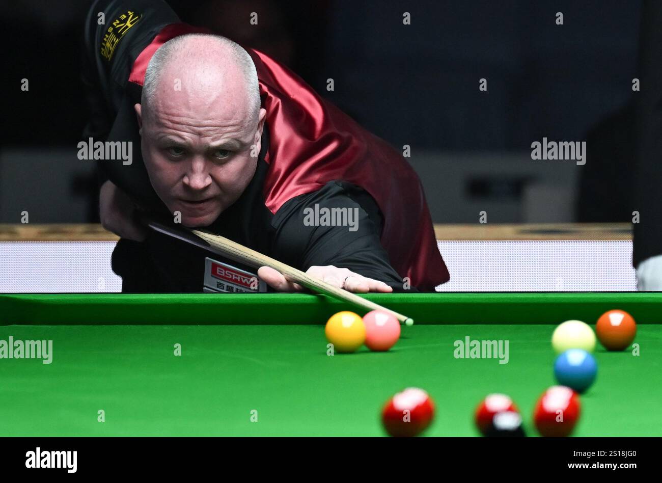 Hangzhou,China.1st January 2025. John Higgins of Scotland plays a shot ...