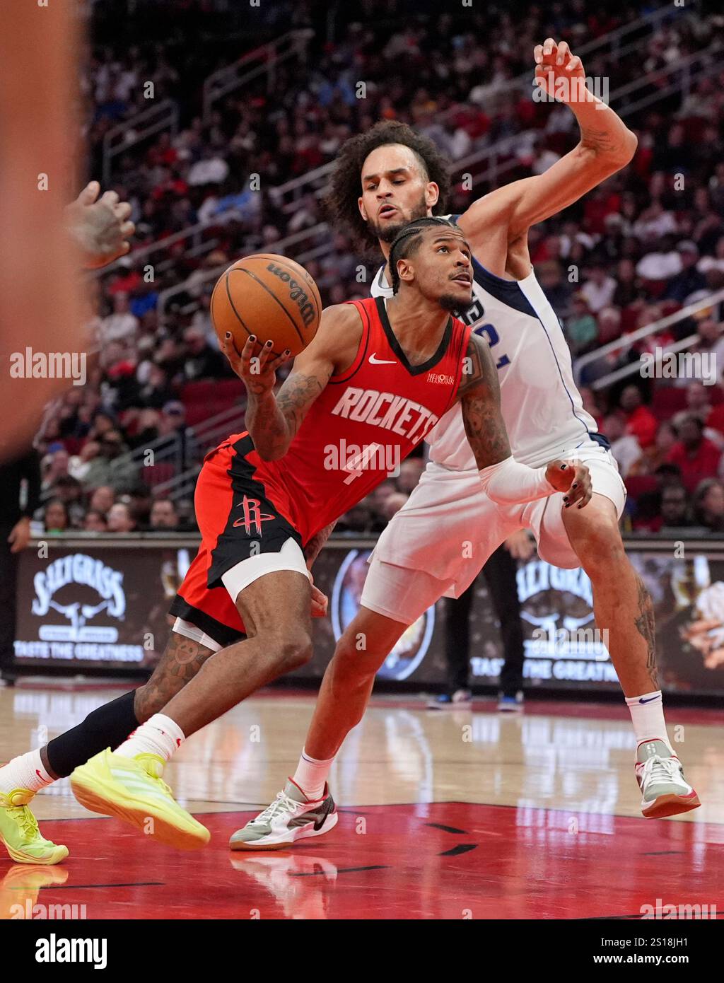 Houston Rockets' Jalen Green (4) drives to the basket as Dallas ...